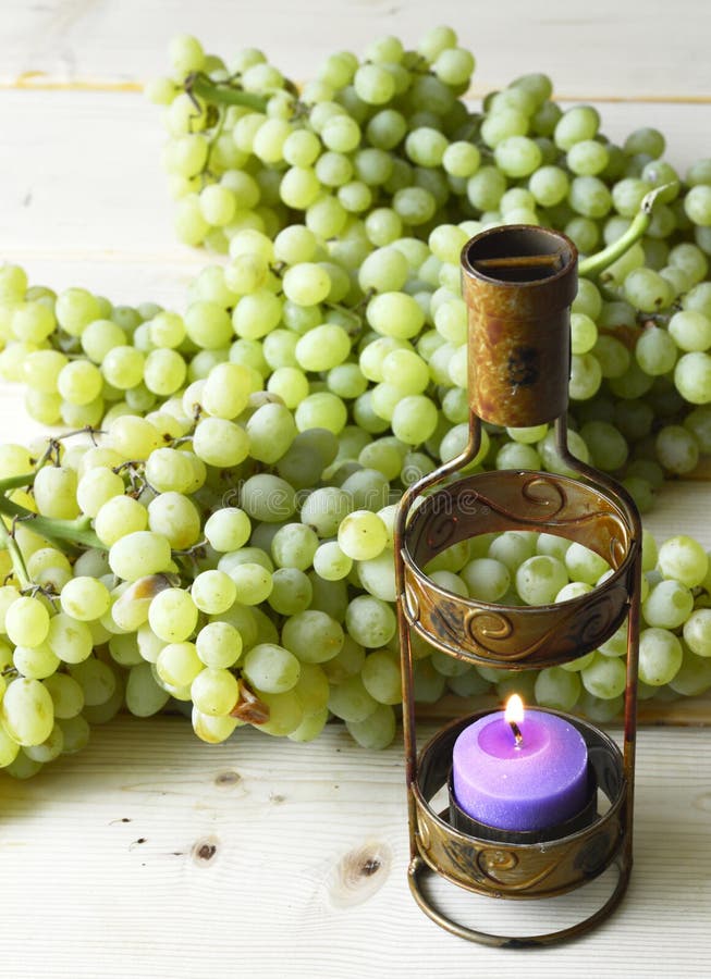 Grapes and candle. stock photo. Image of bottle, christmas - 44441704
