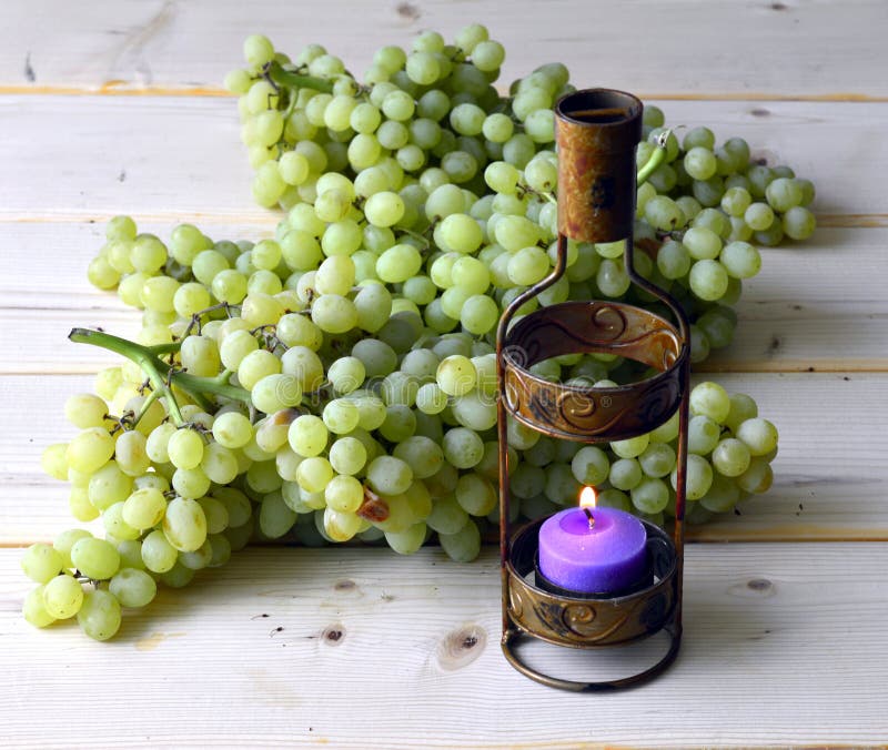Grapes and candle. stock image. Image of lifestyle, celebrate - 44441739