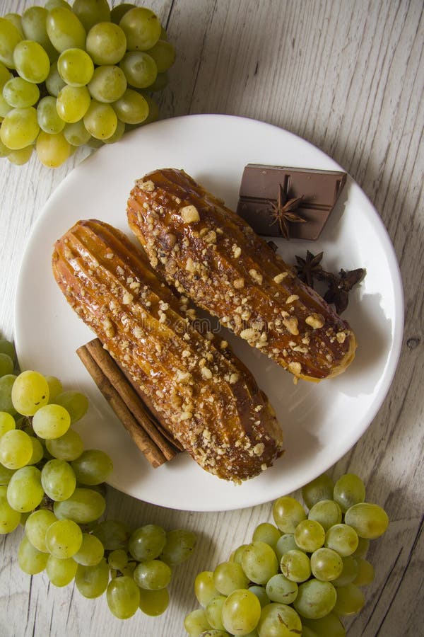 Grapes with eclairs stock image. Image of grapes, picnic - 59483591