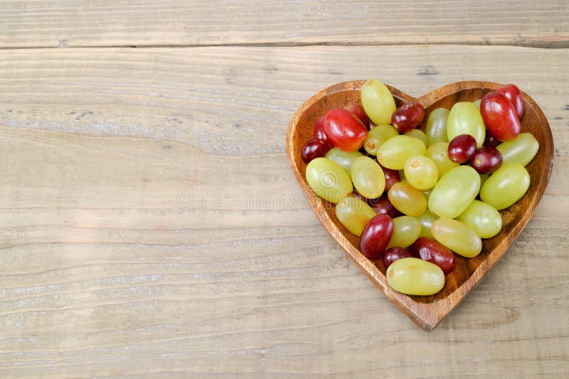 Grapes in a Heart Shaped Plate Stock Image - Image of studio, table ...