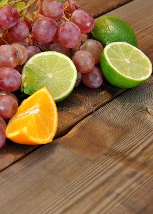 Grapes, Limes, Lemons and Oranges Stock Photo - Image of colorful ...