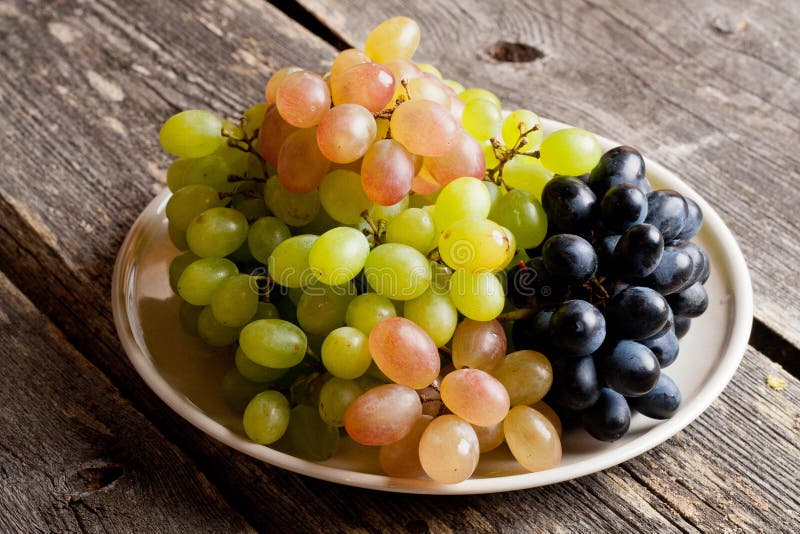 Grapes on a Plate on a Old Wooden Table. Stock Image - Image of leaf ...
