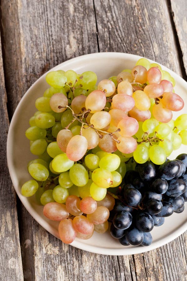Grapes on a Plate on a Old Wooden Table. Stock Image - Image of bunch ...
