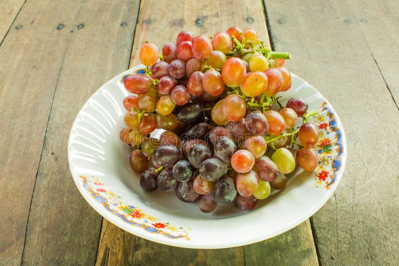 Grapes on a Plate stock image. Image of harvest, bunch - 46681655