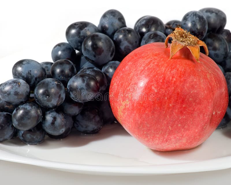 Grapes and Pomegranate Closeup Stock Photo - Image of macro, grapes ...