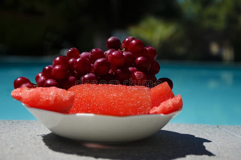 Grapes and Watermelon by the Swimmimg Pool Stock Image - Image of ...