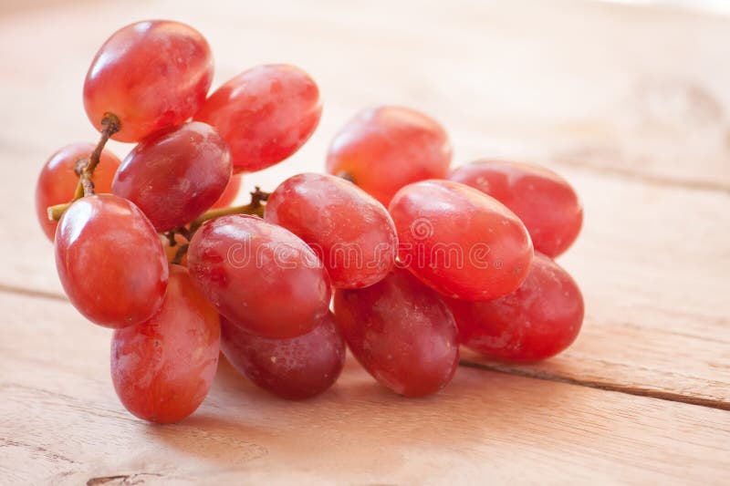 Grapes on wooden table stock photo. Image of wooden, grapes - 75076544