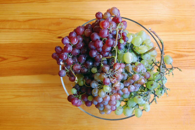 Grapes on wooden table stock photo. Image of grapes - 101303496