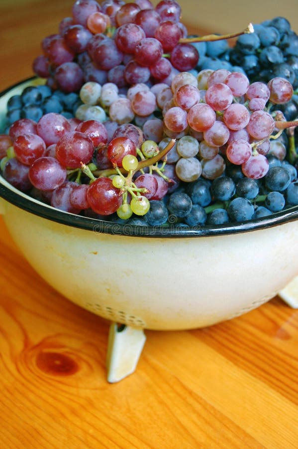 Grapes on wooden table stock image. Image of grapes - 101308339