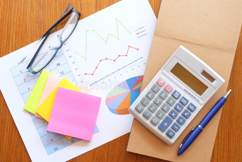 Graph paper and calculator stock photo. Image of finance - 97419410