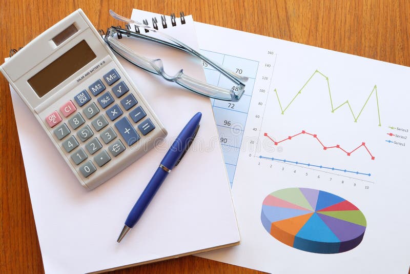 Graph paper and calculator stock photo. Image of finance - 97420386