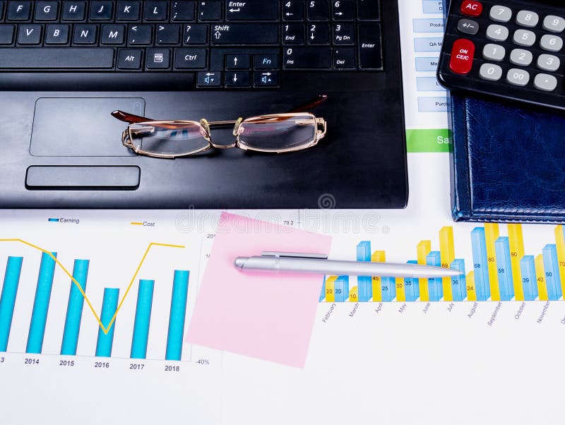 Graphic Charts and Laptop on the Table Stock Image - Image of ballpoint ...