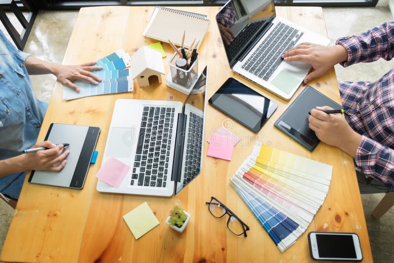 Group of Business People Working on an Office Desk Stock Image - Image ...