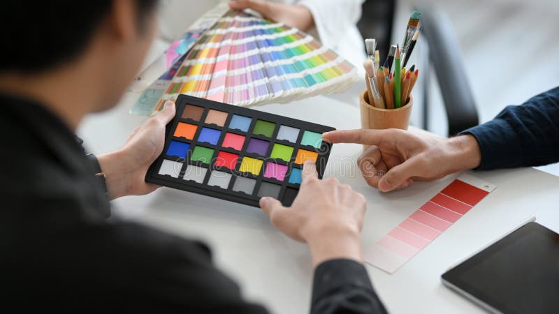 The Graphic Design Team is Sharing Creative Ideas for Their Project ...