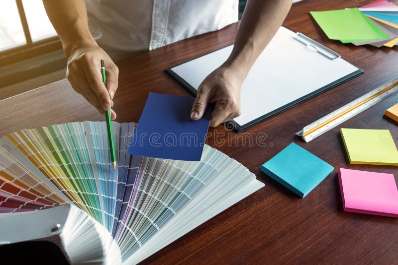 Graphic Designer Choose Colors from the Color Bands Samples for Design ...