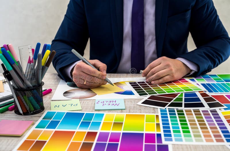 Graphic Designer Choosing a Color from a Sampler at Office. Man Hands ...