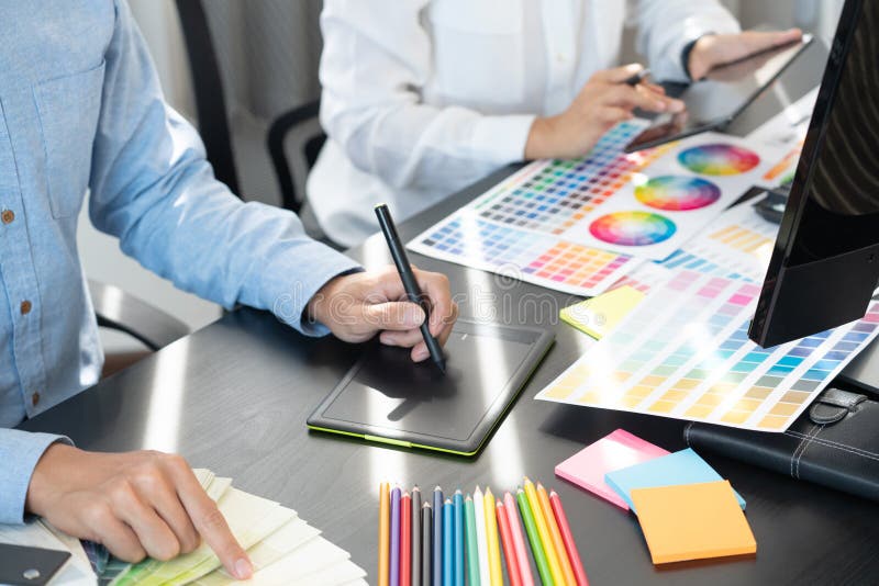 Graphic Designer or Creative Working Together Coloring Using Graphics ...