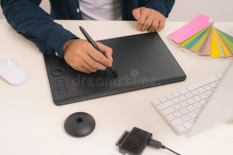 Graphic Designer Drawing on Graphics Tablet at Workplace Stock Photo ...