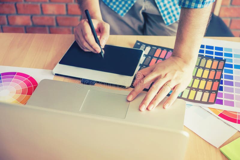 Graphic Designer Drawing on Graphics Tablet at Workplace Stock Photo ...