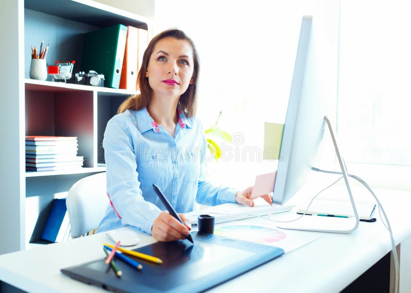 Graphic Designer Drawing Something on Graphic Tablet at the Work Stock ...