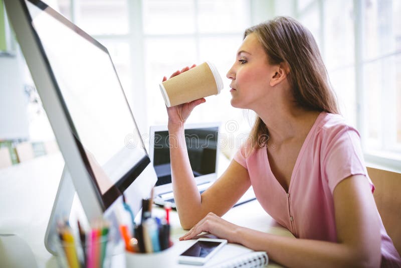 Graphic Designer Drinking Coffee at Desk Stock Image - Image of ...