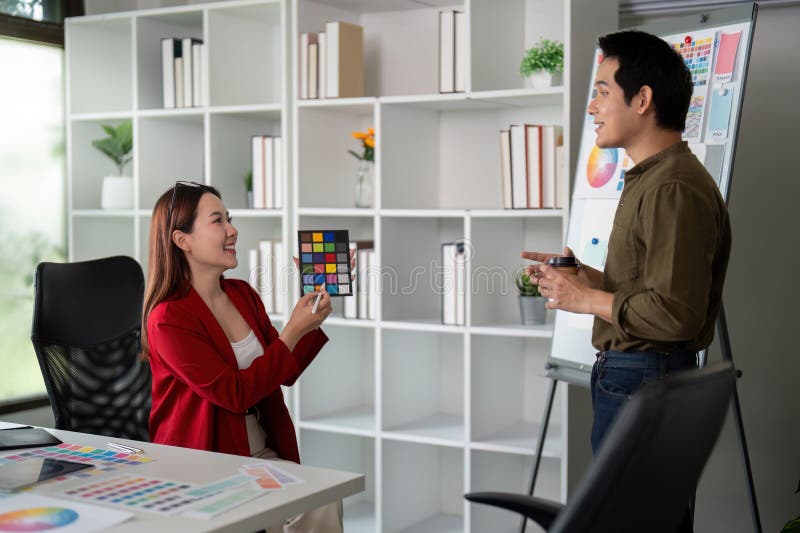 Graphic Design and Collaboration. Team Members Discussing Color Choices ...