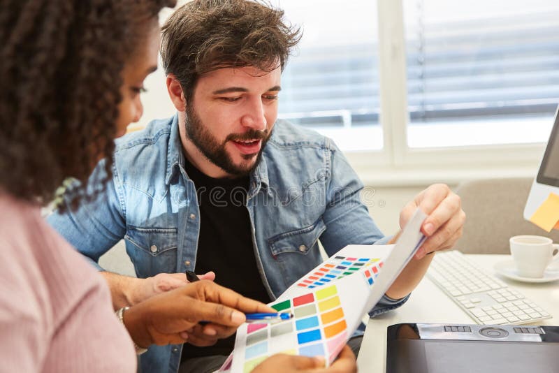 Graphic Designer Team in Choosing Colors Stock Photo - Image of team ...