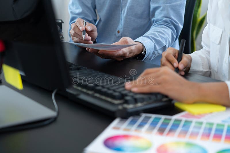 Graphic Designer Team Working on Web Design Using Color Swatches ...