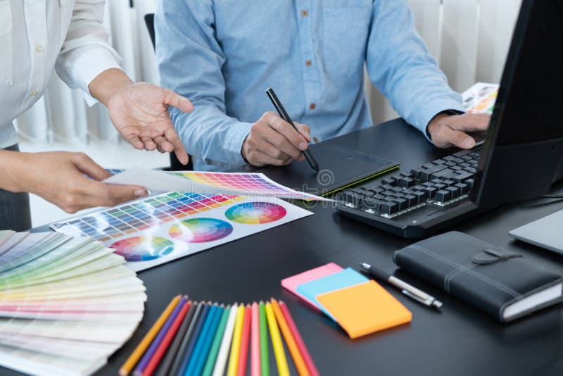 Graphic Designer Team Working on Web Design Using Color Swatches ...
