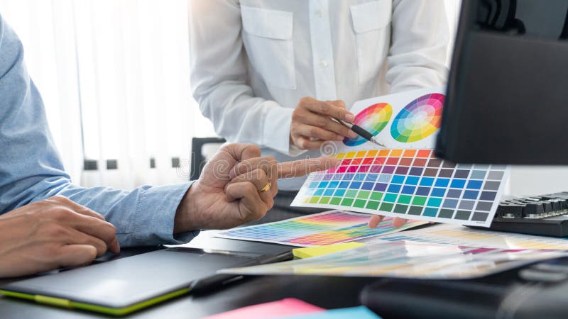 Graphic Designer Team Working on Web Design Using Color Swatches ...