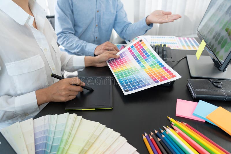 Graphic Designer Team Working on Web Design Using Color Swatches ...