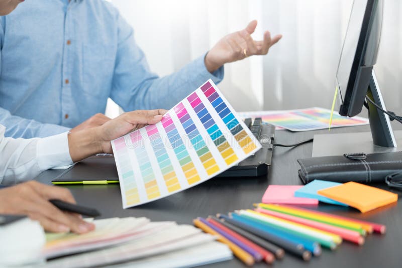 Graphic Designer Team Working on Web Design Using Color Swatches ...