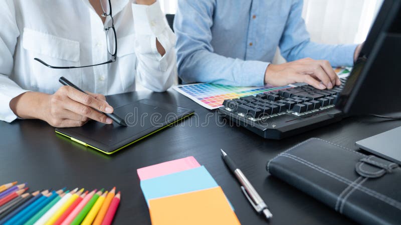 Graphic Designer Team Working on Web Design Using Color Swatches ...