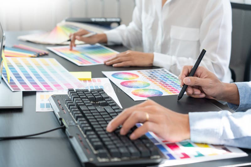 Graphic Designer Team Working on Web Design Using Color Swatches ...