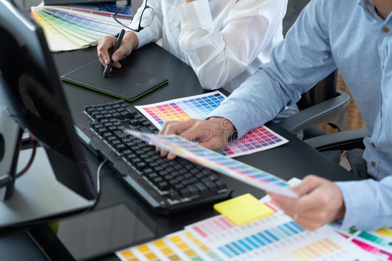 Graphic Designer Team Working on Web Design Using Color Swatches ...