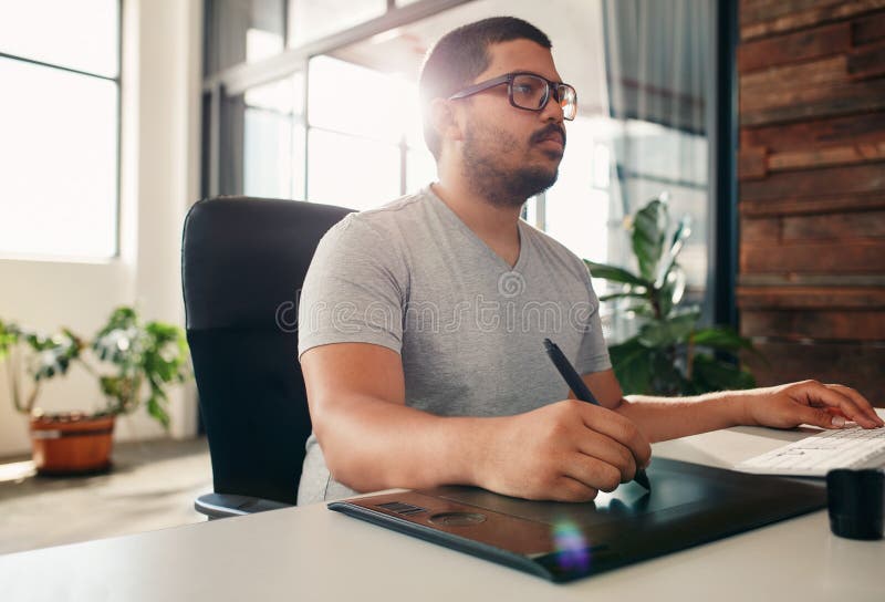 Man Using Graphics Tablet stock photo. Image of generated - 23044626