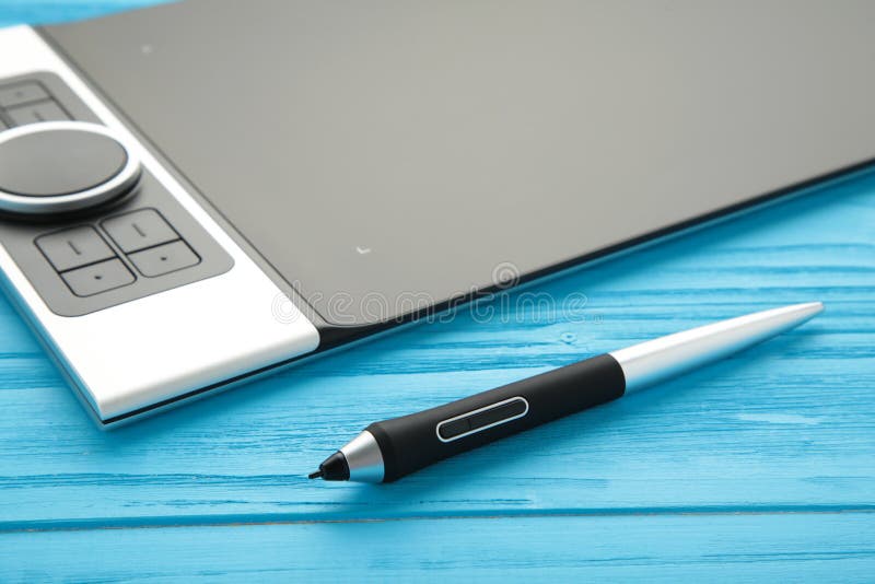 Graphic Designer Using Digital Tablet on Blue Background Stock Photo ...