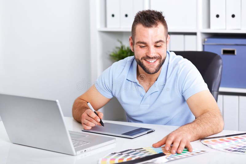 Graphic Designer Using a Graphics Tablet in a Modern Office Stock Photo ...