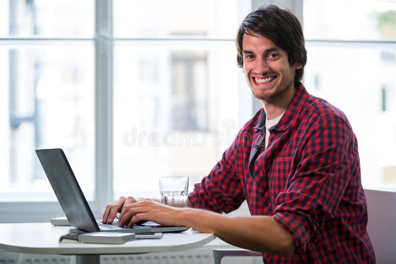 Graphic Designer Using Laptop and Digital Tablet at His Desk Stock ...