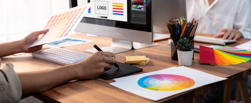 Graphic Designer Works on Computer Laptop with Digital Pen. Scrutinize ...