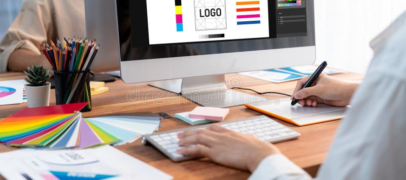 Graphic Designer Works on Computer Laptop with Digital Pen. Scrutinize ...