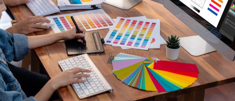 Graphic Designer Works on Computer Laptop with Digital Pen. Scrutinize ...