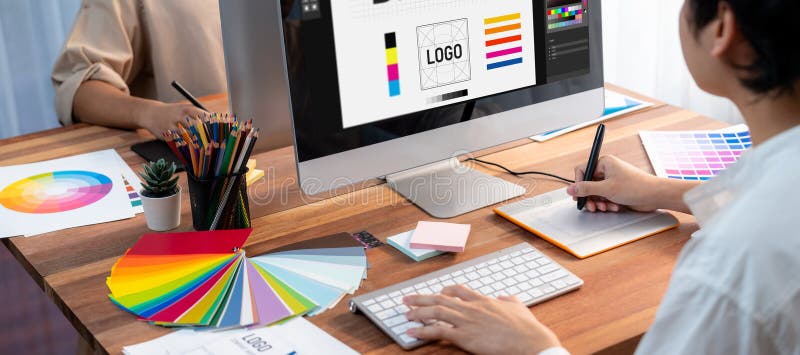 Graphic Designer Works on Computer Laptop with Digital Pen. Scrutinize ...