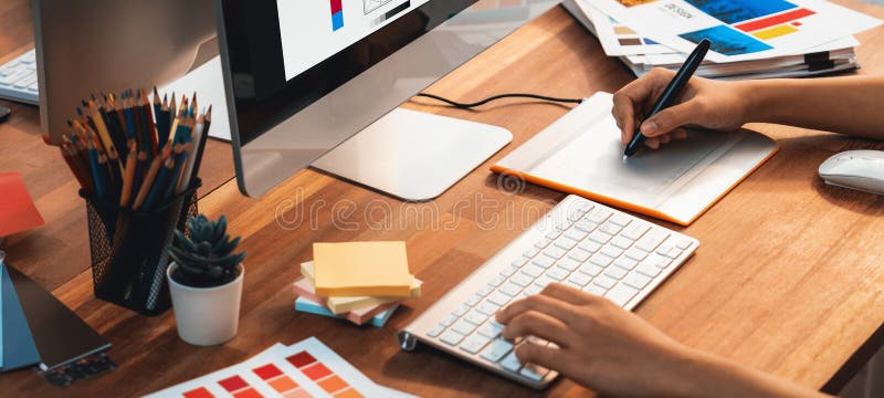 Graphic Designer Works on Computer Laptop with Digital Pen. Scrutinize ...
