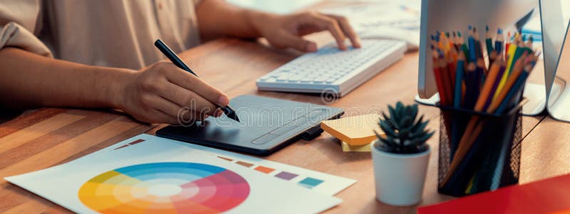 Graphic Designer Works on Computer Laptop with Digital Pen. Scrutinize ...