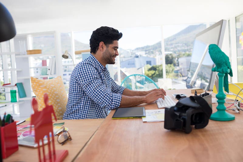 Graphic Designer Working on Computer at Desk Stock Image - Image of ...