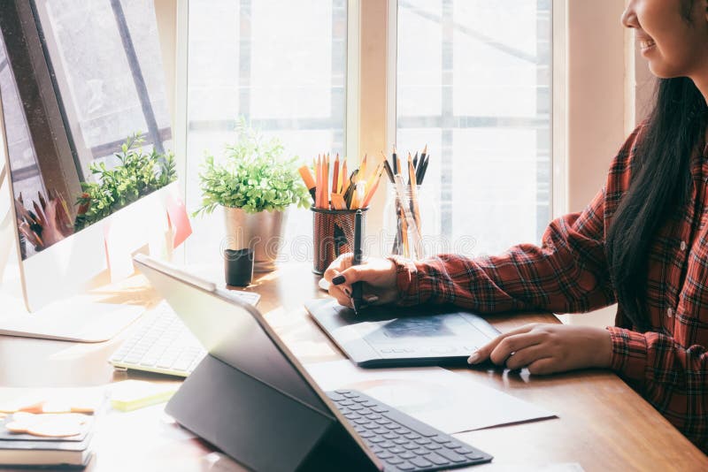 Graphic Designer Working on Computer and Used Graphics Tablet Stock ...