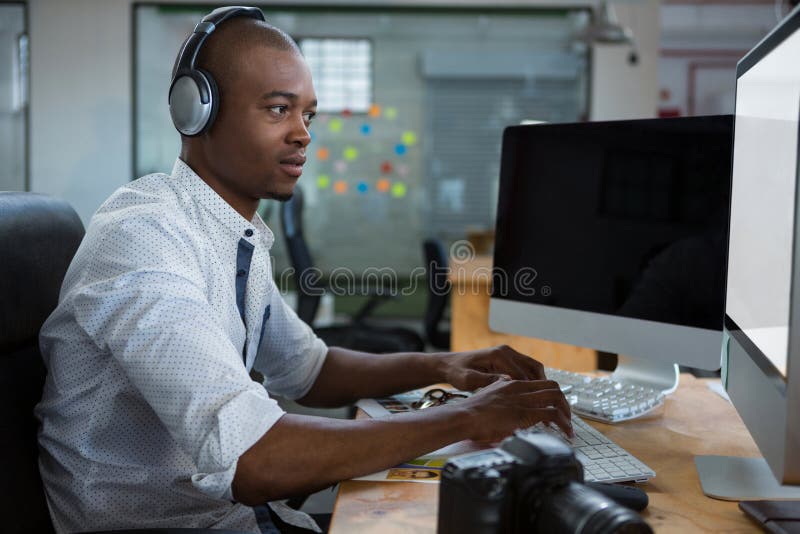 Graphic Designer Working at Desk Stock Image - Image of confident ...