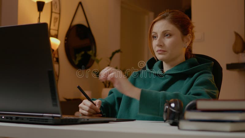 Graphic Designer Working from Home Using Laptop and Tablet Stock Video ...