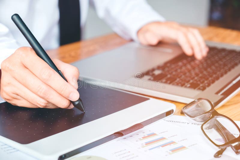 Graphic Designer Working and Writing on Graphic Tablet while Using ...